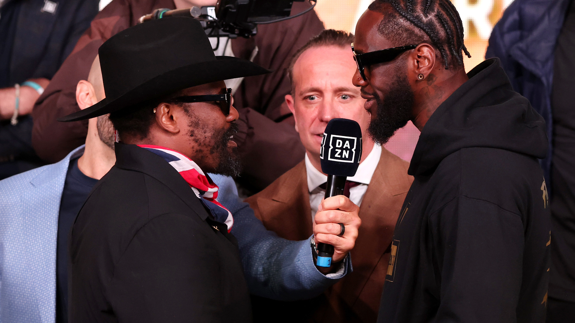 Derek Chisora, Deontay Wilder with unusual mic'd up staredown | DAZN ...