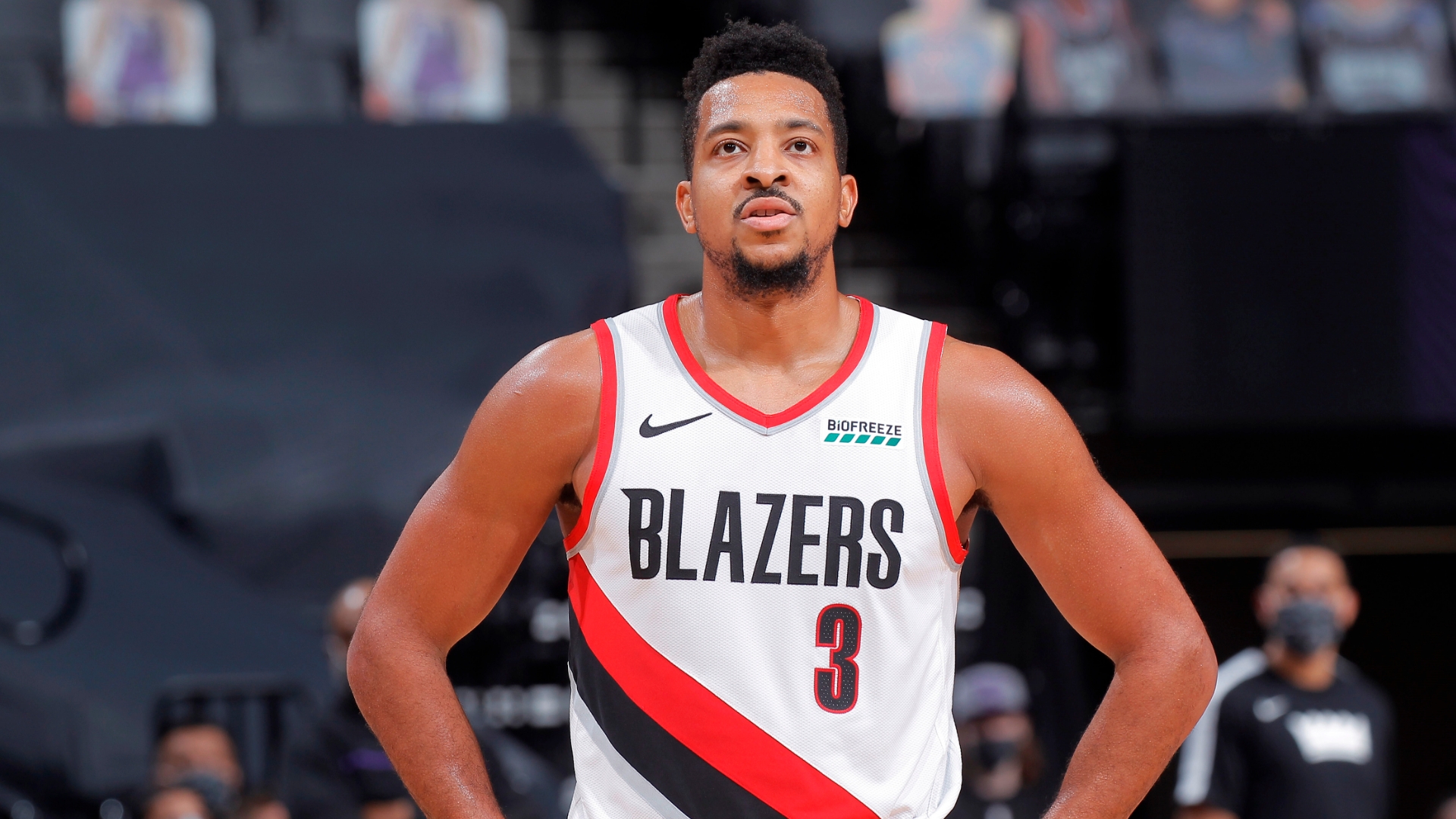 Trail Blazers' CJ McCollum sprains left foot, to remain in walking boot ...