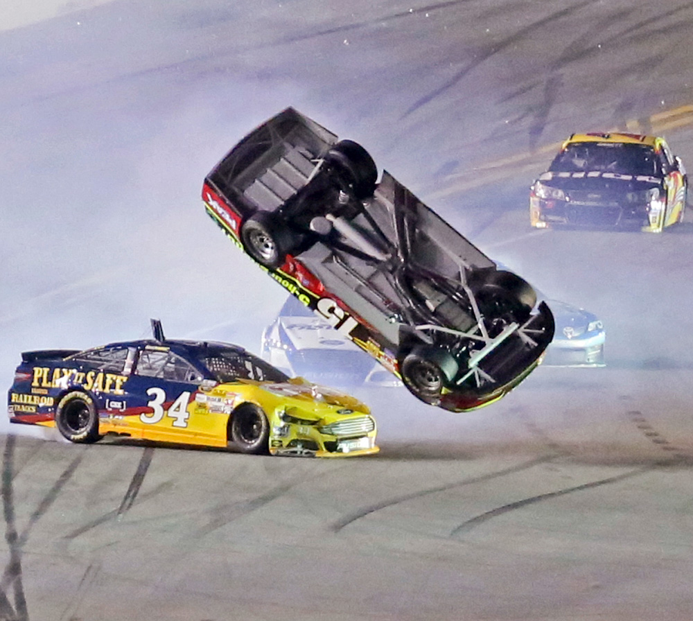 Clint Bowyer's car flips after Johnson causes big wreck at Daytona ...