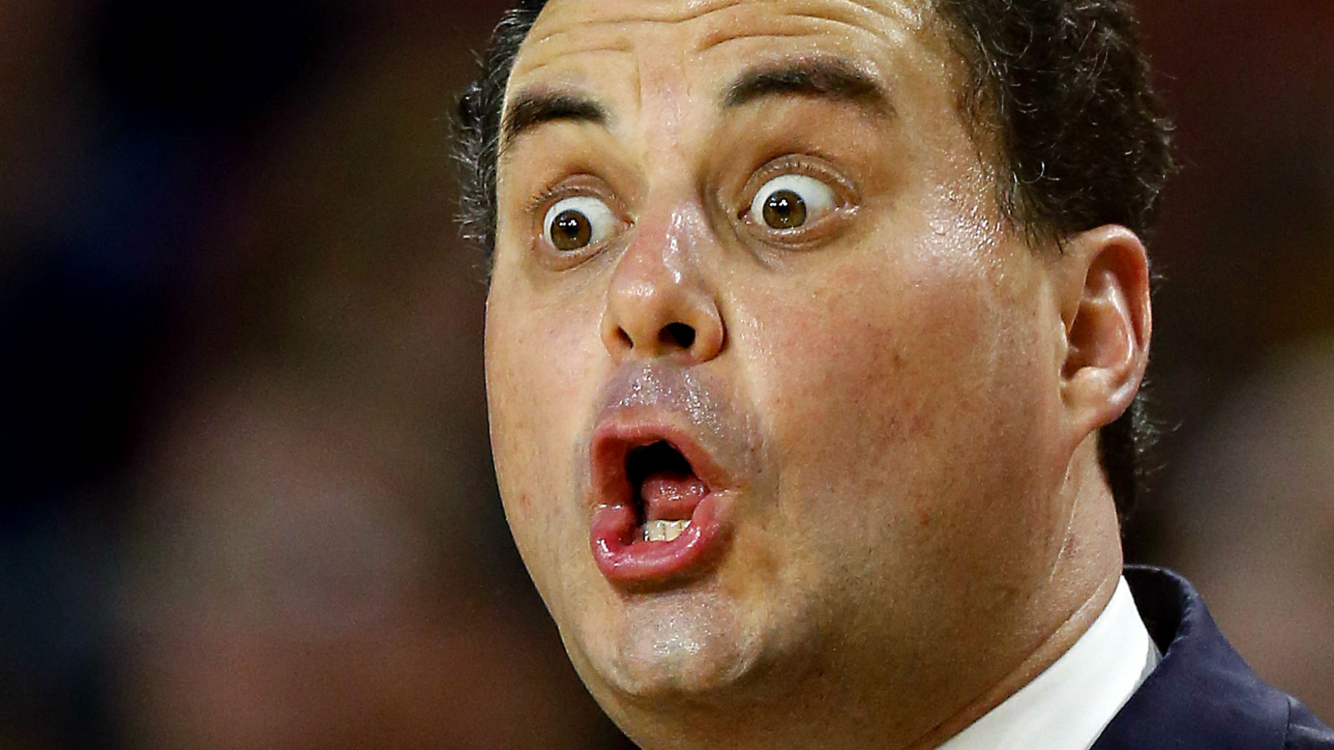 It took Arizona coach Sean Miller less than a half to sweat through his ...